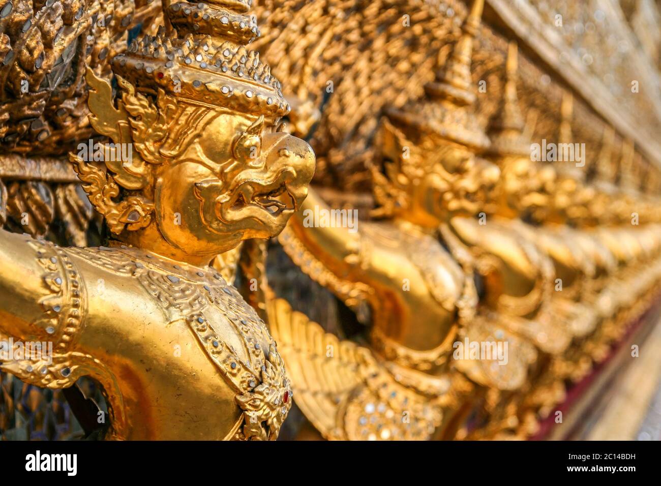 Golden sculptures in a temple Stock Photo - Alamy