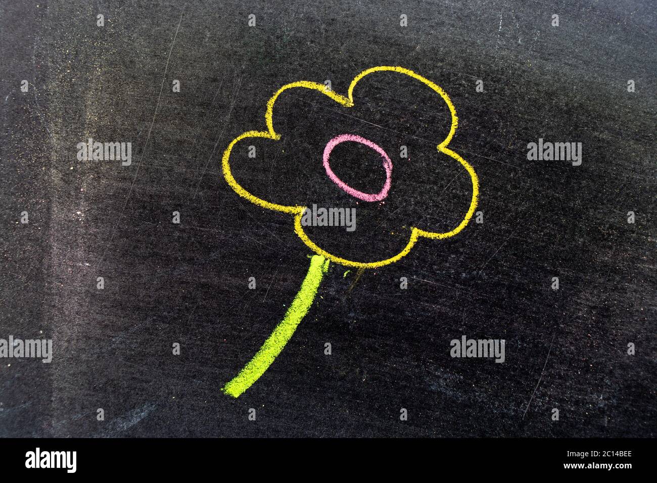 Color chalk drawing in blooming flower shape on blackboard background ...