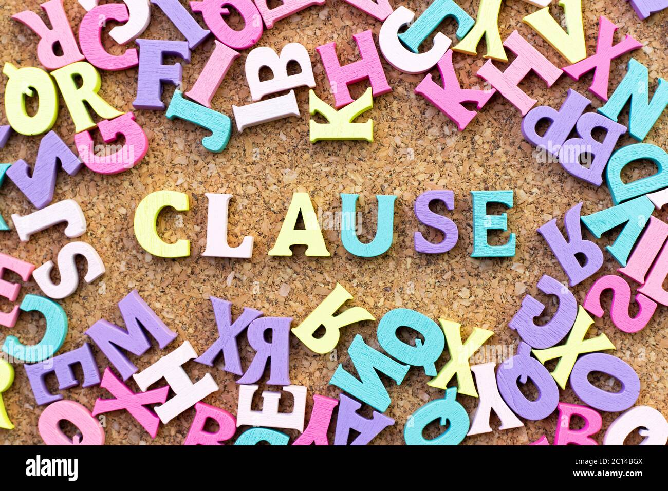 Color alphabet in word clause with another letter as frame on cork ...