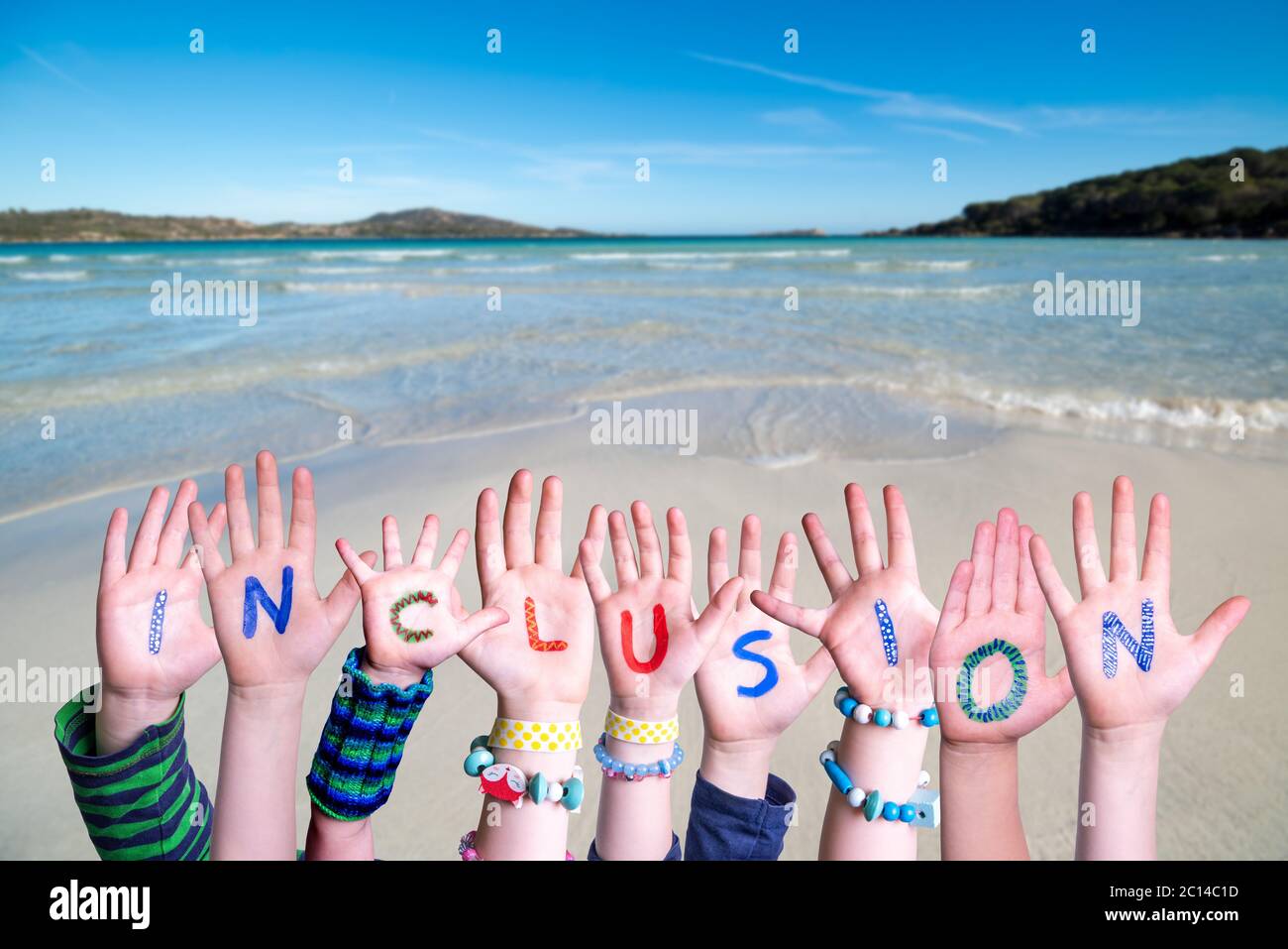 Children Hands Building Word Inclusion, Ocean Background Stock Photo ...