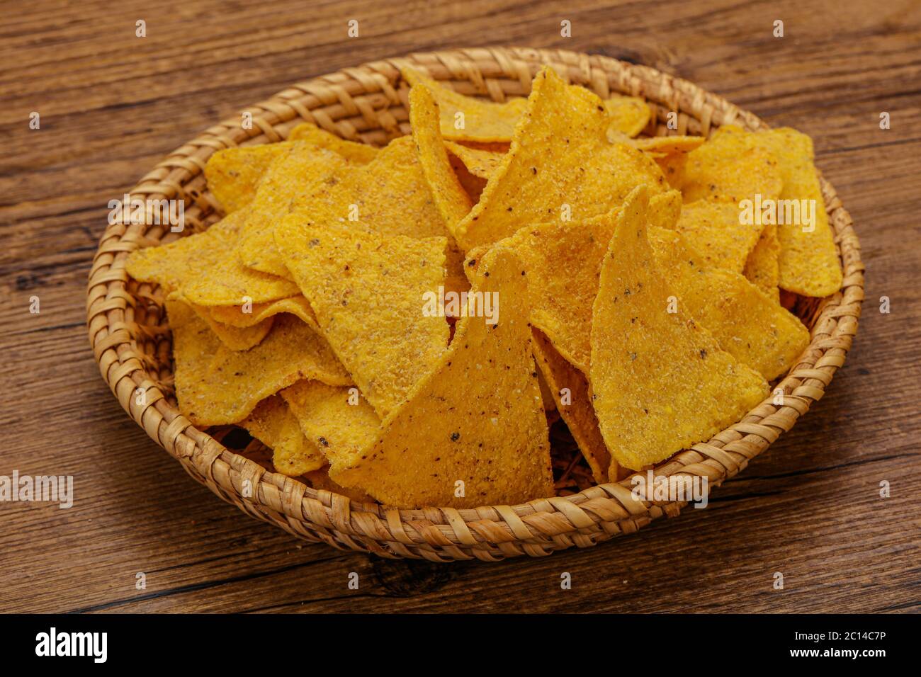 Mexican crunchy corn nachos triangle heap Stock Photo - Alamy