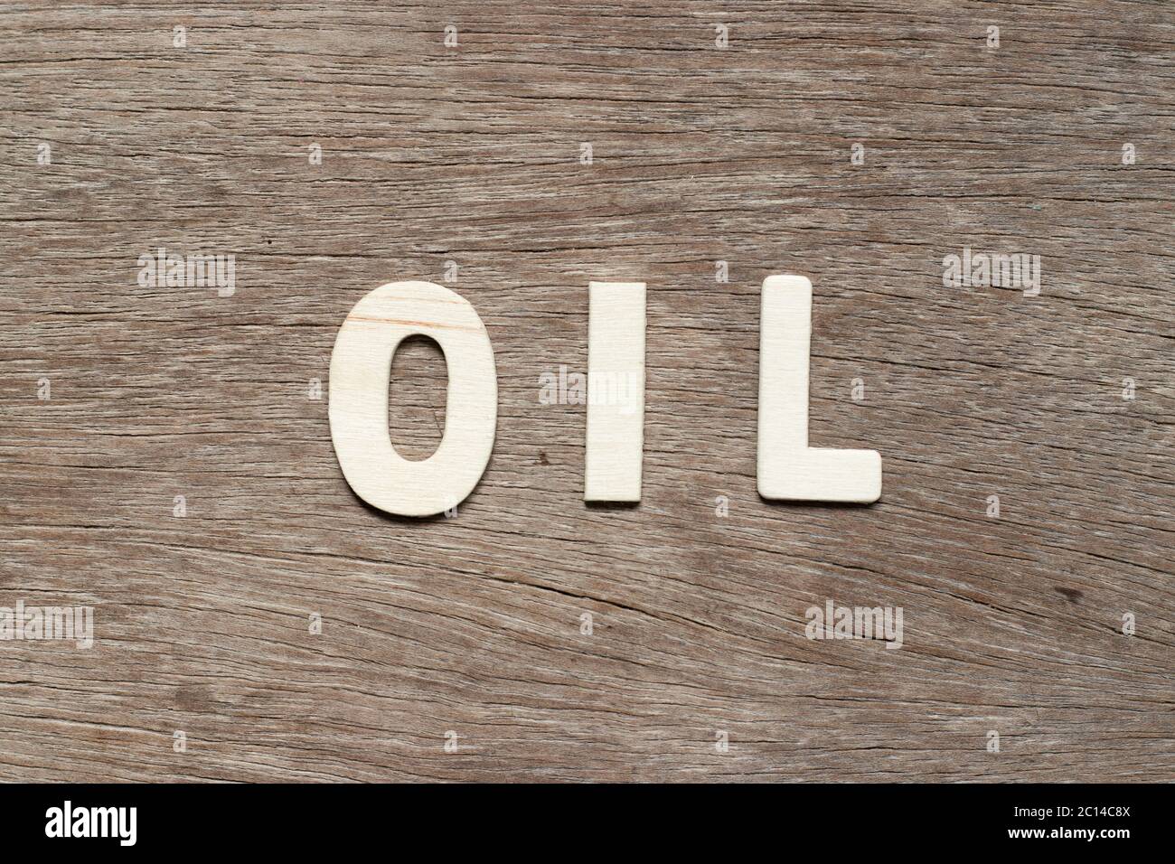 Alphabet letter in word oil on wood background Stock Photo - Alamy