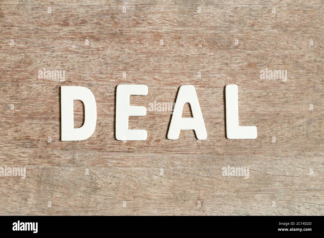 Alphabet letter in word deal on wood background Stock Photo - Alamy