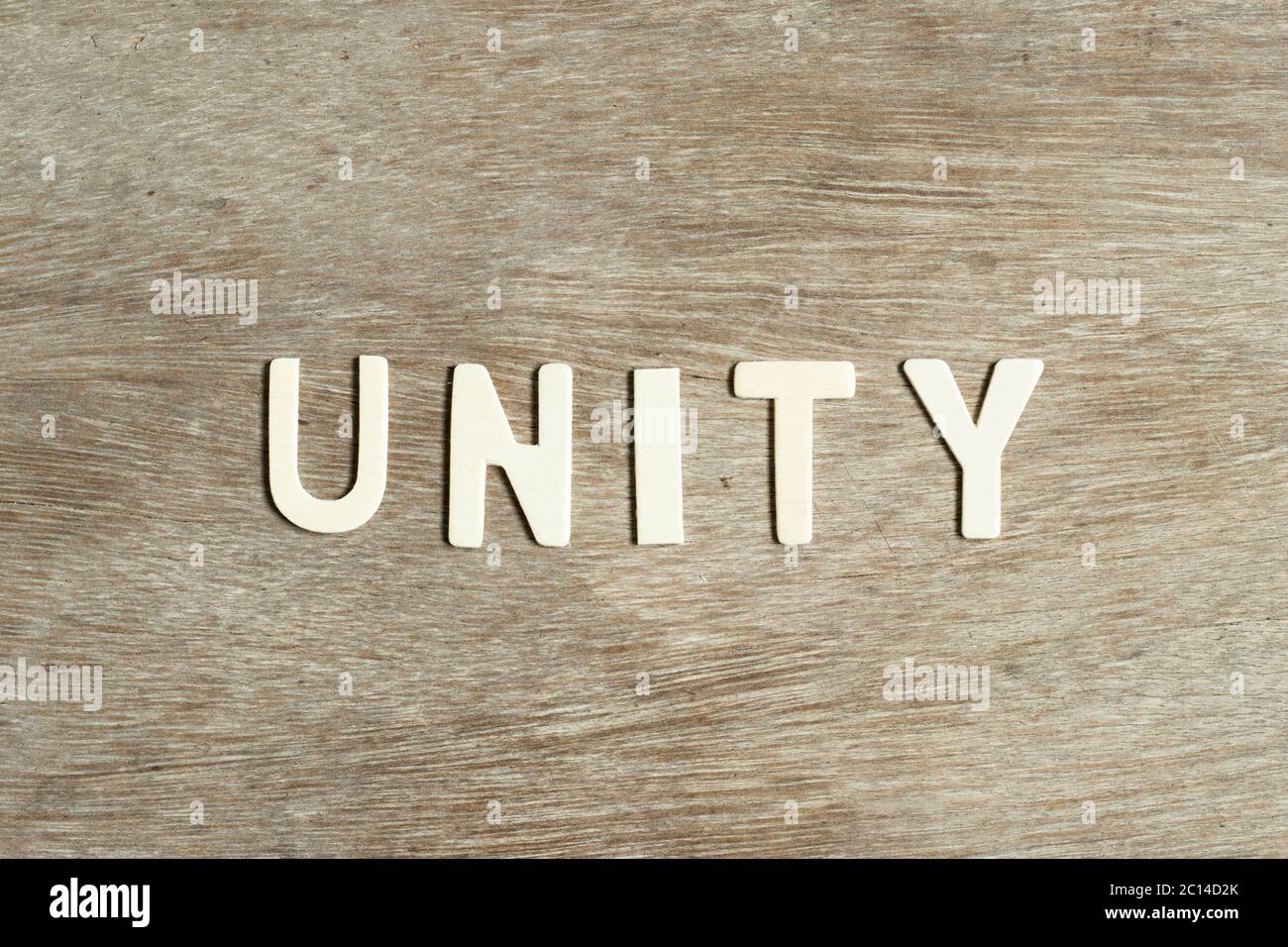 Alphabet letter in word unity on wood background Stock Photo - Alamy