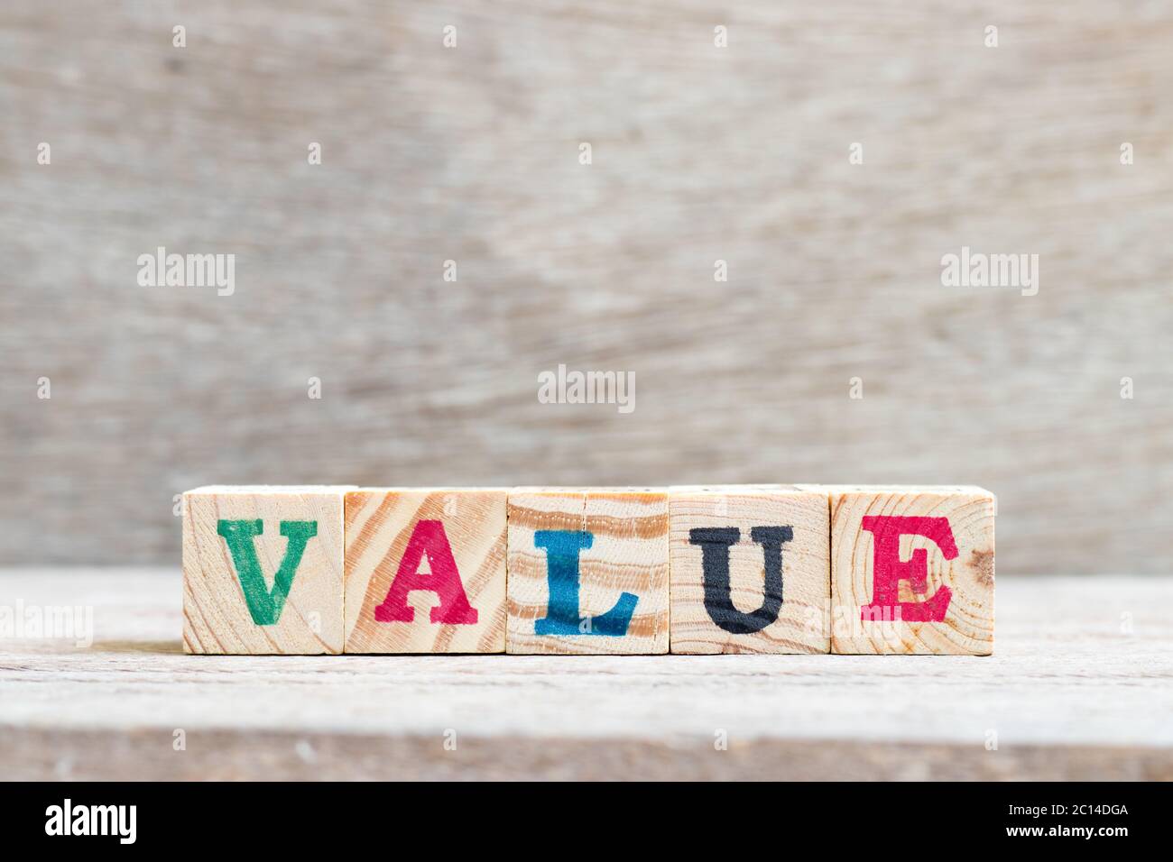 Letter block in word value on wood background Stock Photo - Alamy