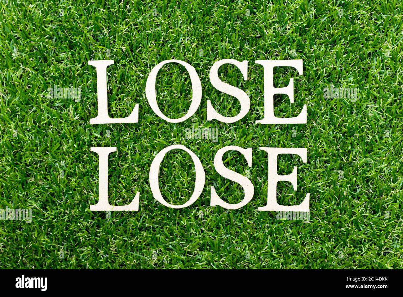 Wood alphabet letter in word lose lose on green grass background Stock ...