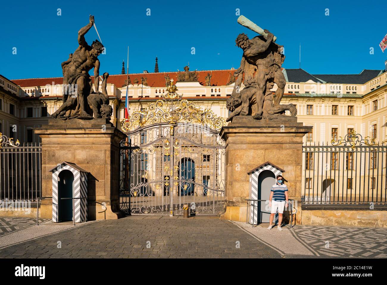 Almost deserted Main Gate of Prague Castle with Statue of Battling ...