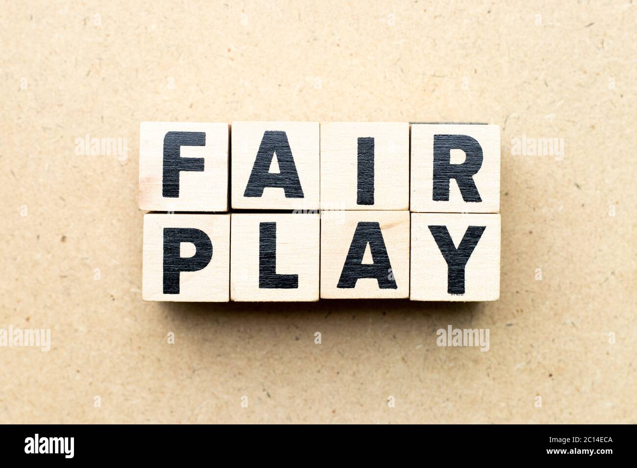 Letter block in word fair play on wood background Stock Photo - Alamy