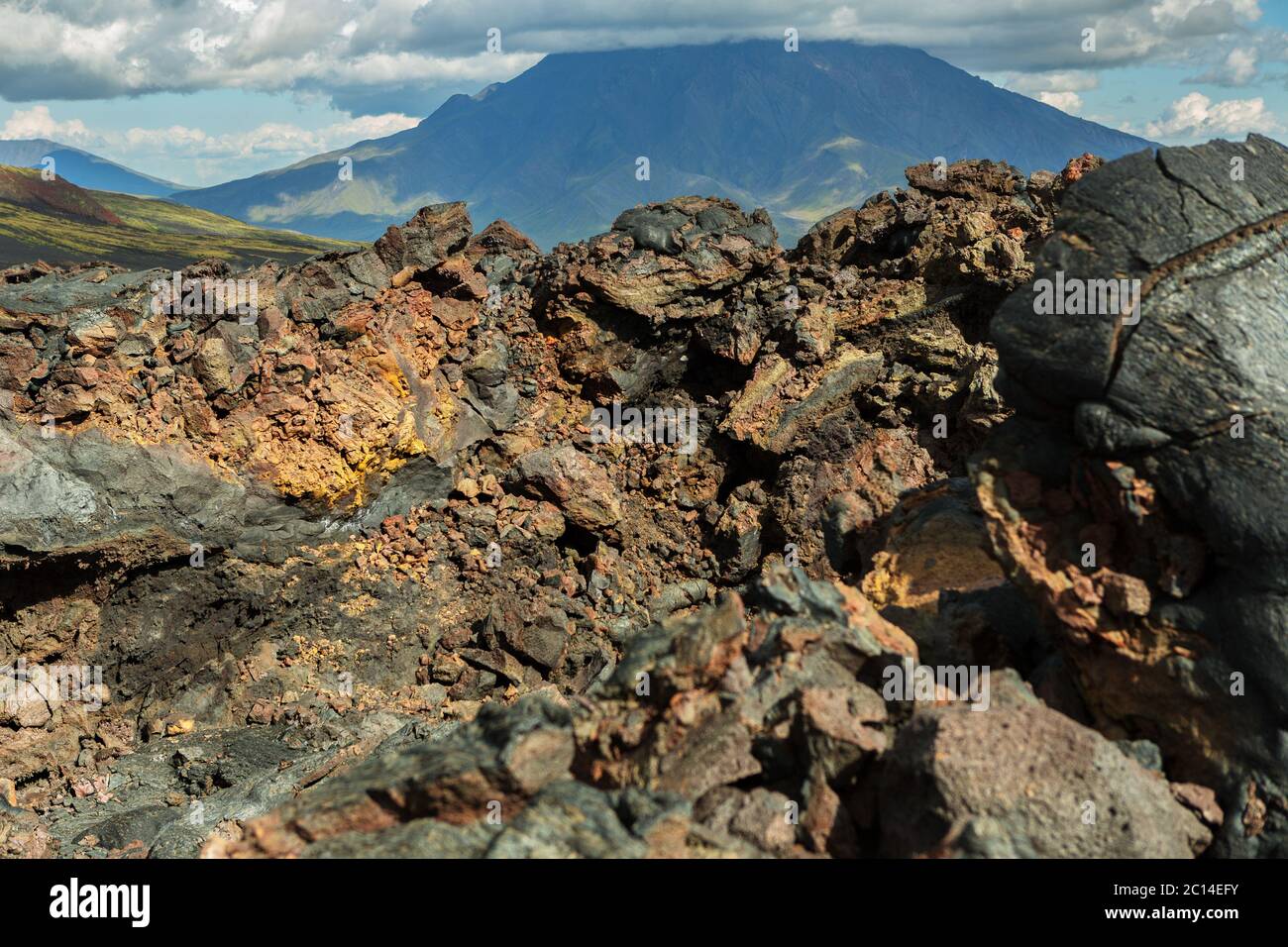 Lava field at Tolbachik volcano, after eruption in 2012 on background ...