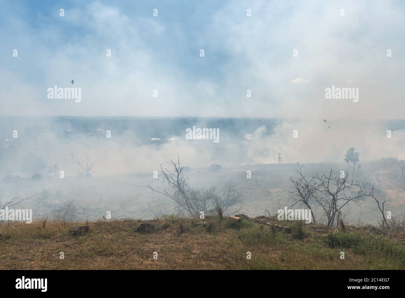Fire brigade performing preventative burn off near country town ...
