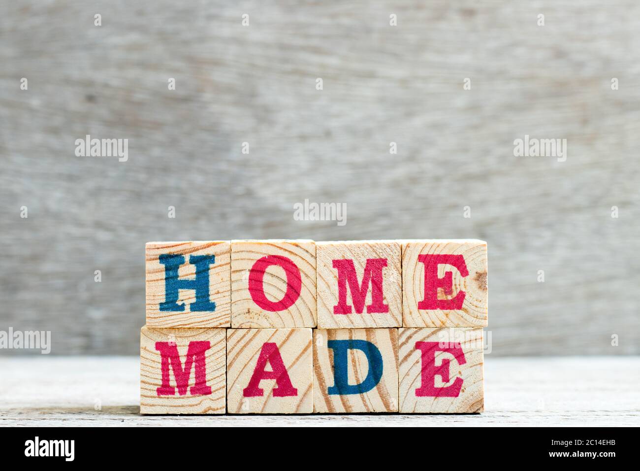 Letter block in word homemade on wood background Stock Photo - Alamy