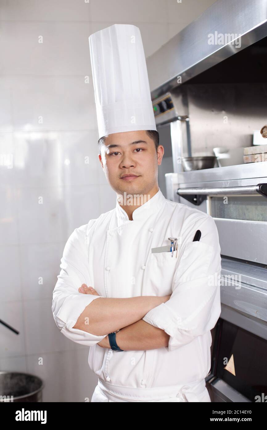 young man chelf in modern kitchen Stock Photo - Alamy