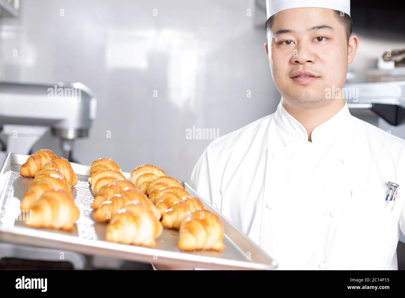 young man chelf makes bread in kitchen Stock Photo - Alamy
