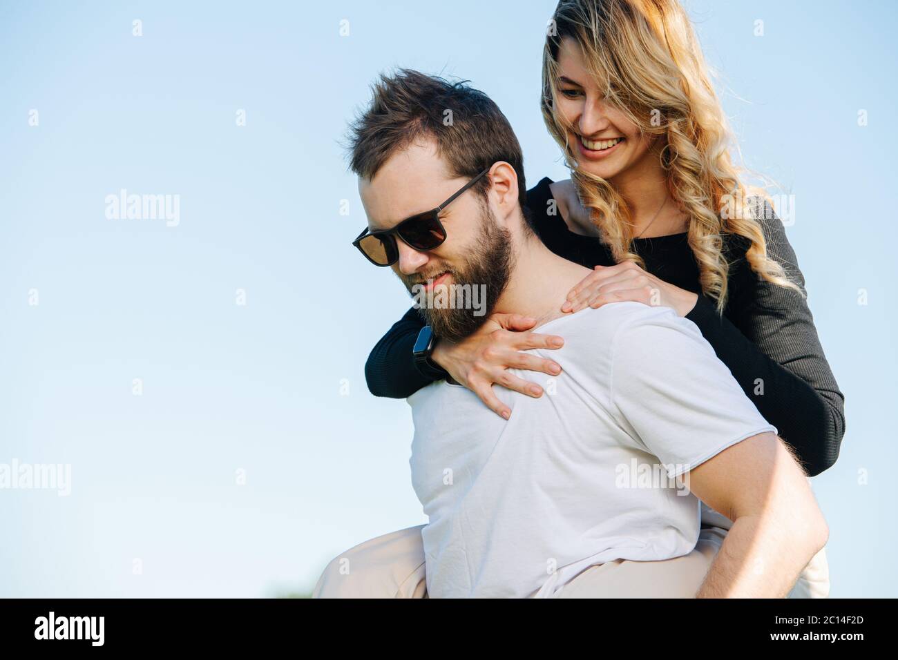 Woman riding on mans back hi-res stock photography and images - Alamy