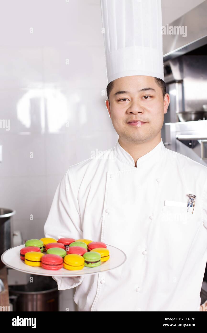 young man chelf makes food in kitchen Stock Photo - Alamy