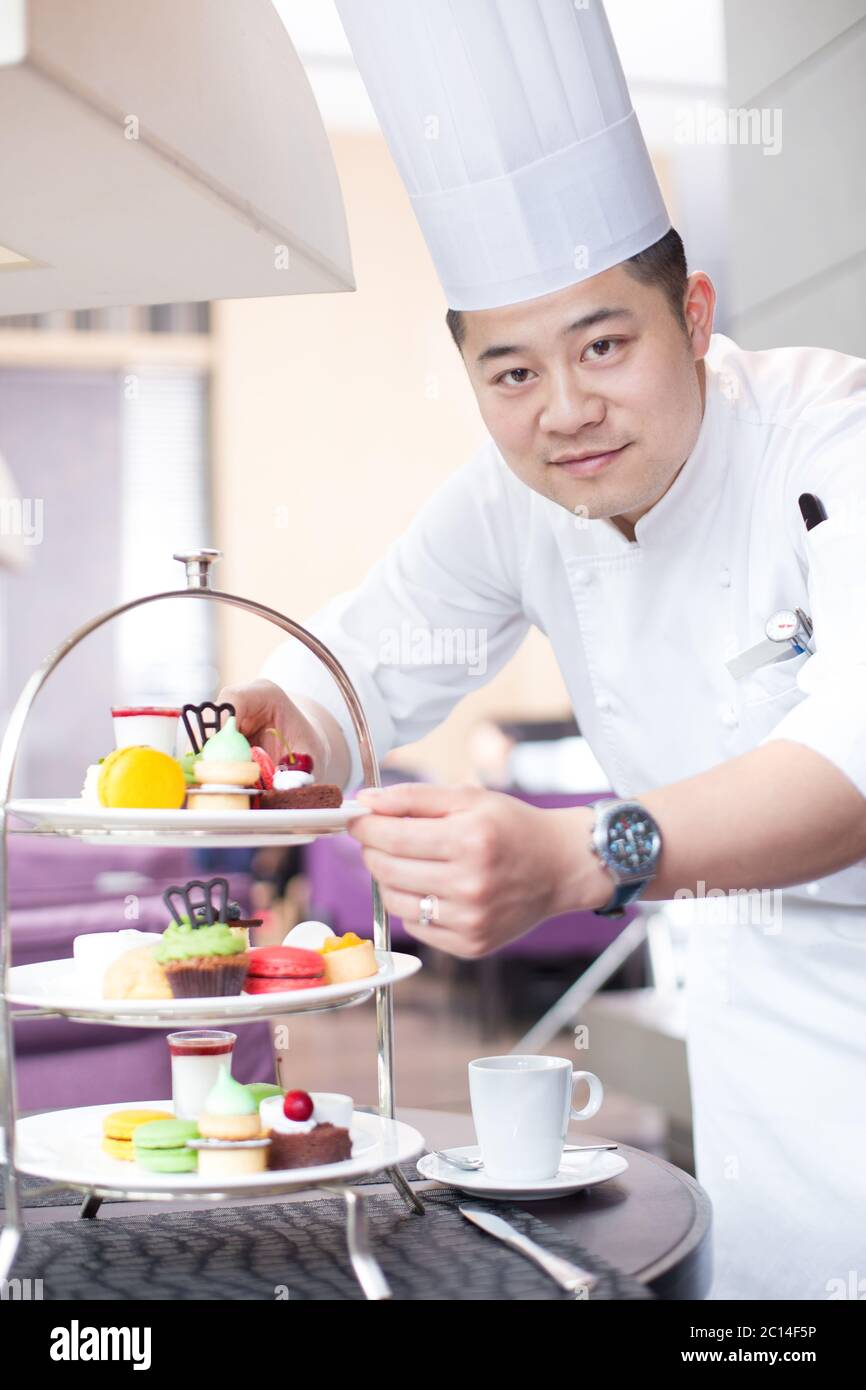 young man chelf makes food Stock Photo - Alamy
