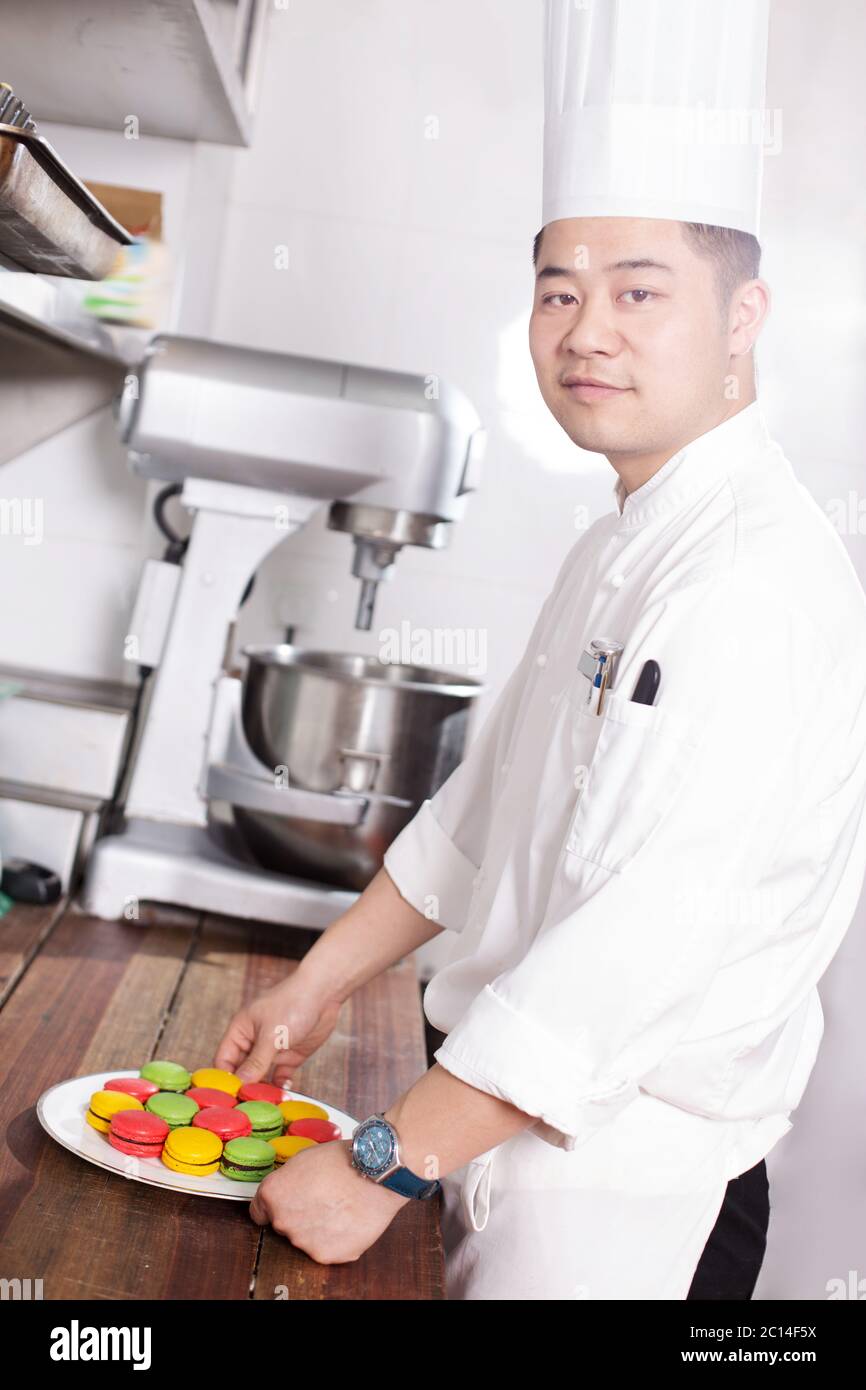 young man chelf makes food in kitchen Stock Photo - Alamy