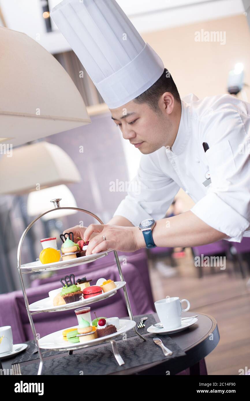 young man chelf makes food Stock Photo - Alamy