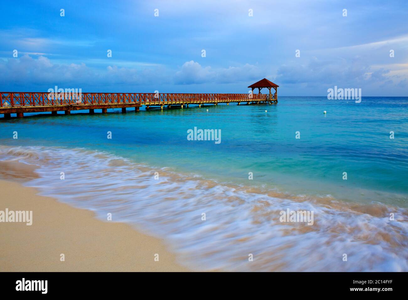 Beach of caribbean sea and wooden pier Stock Photo - Alamy