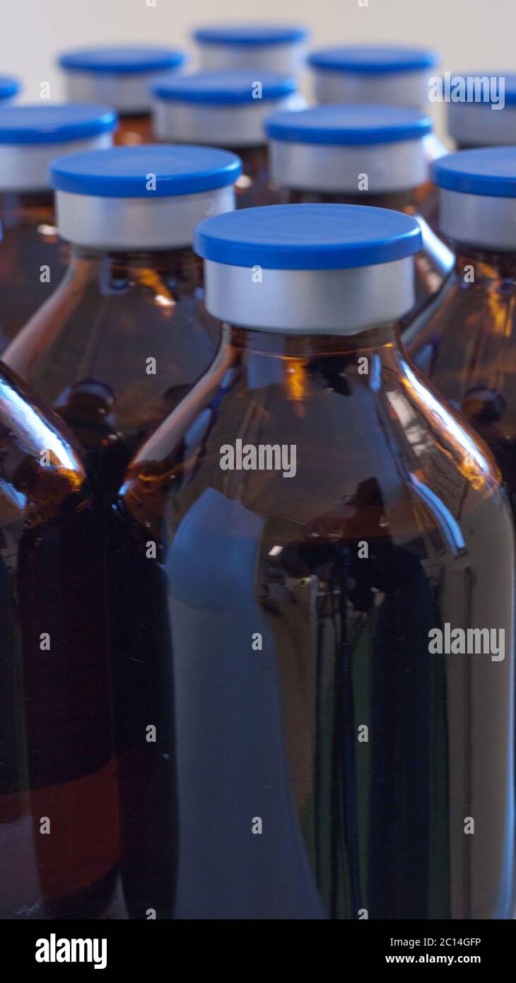 Close-up of some empty brown glass medicine bottles for injection with ...