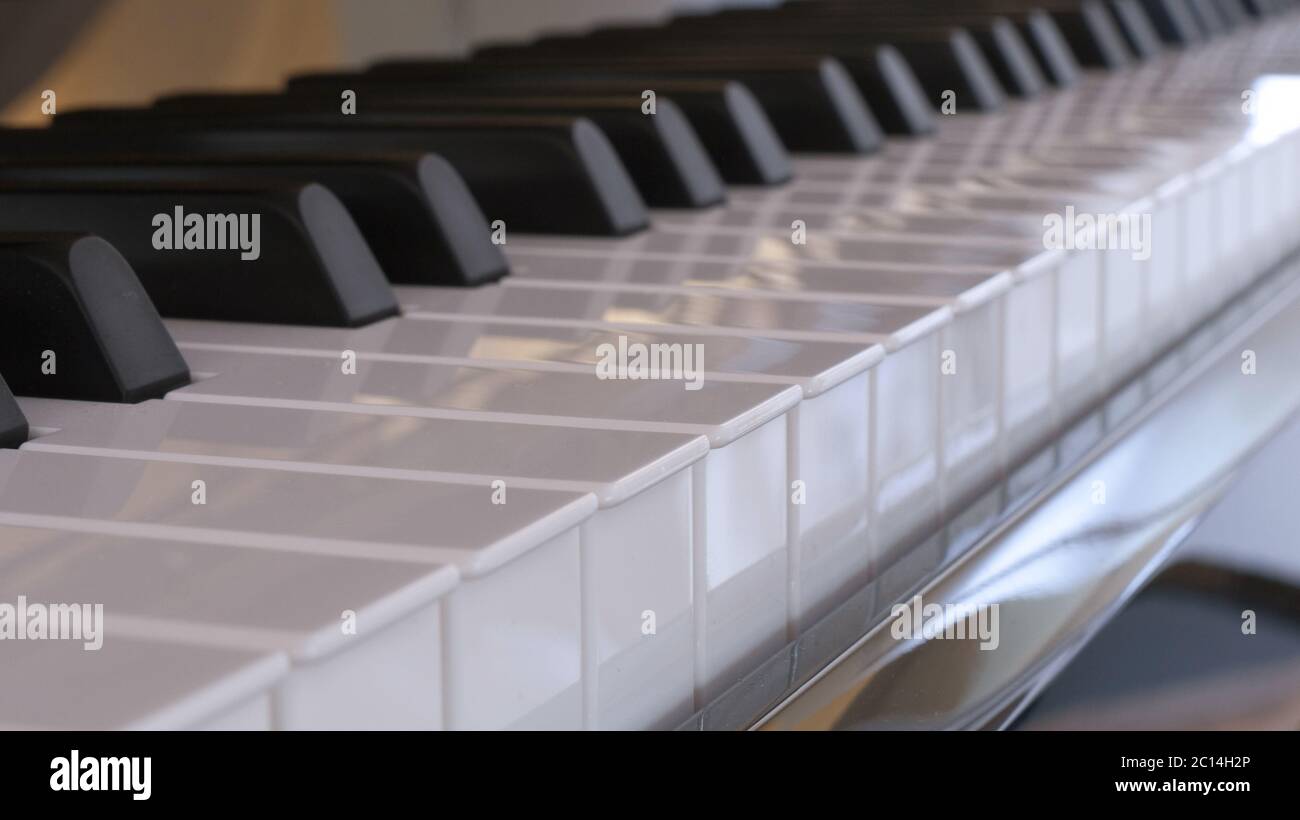 Detail of the keyboard of a piano with white and black keys Stock Photo ...