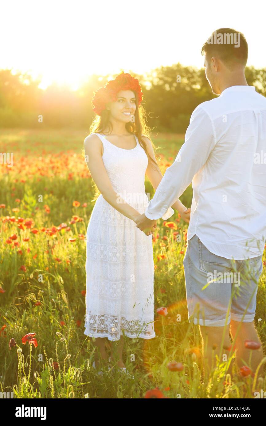 Couple in love taking hands together in nature Stock Photo - Alamy