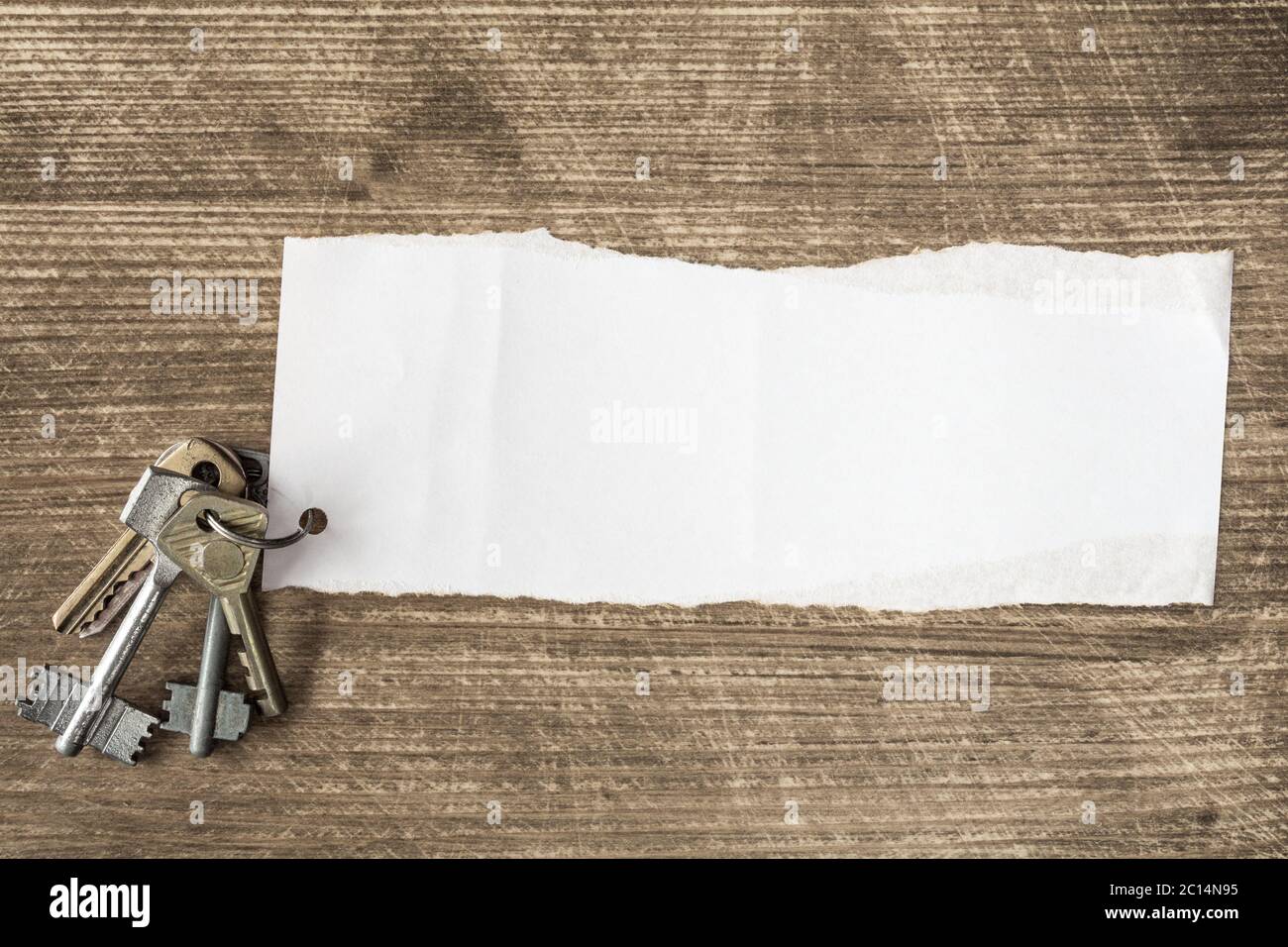 Bunch of keys and blank paper piece Stock Photo - Alamy
