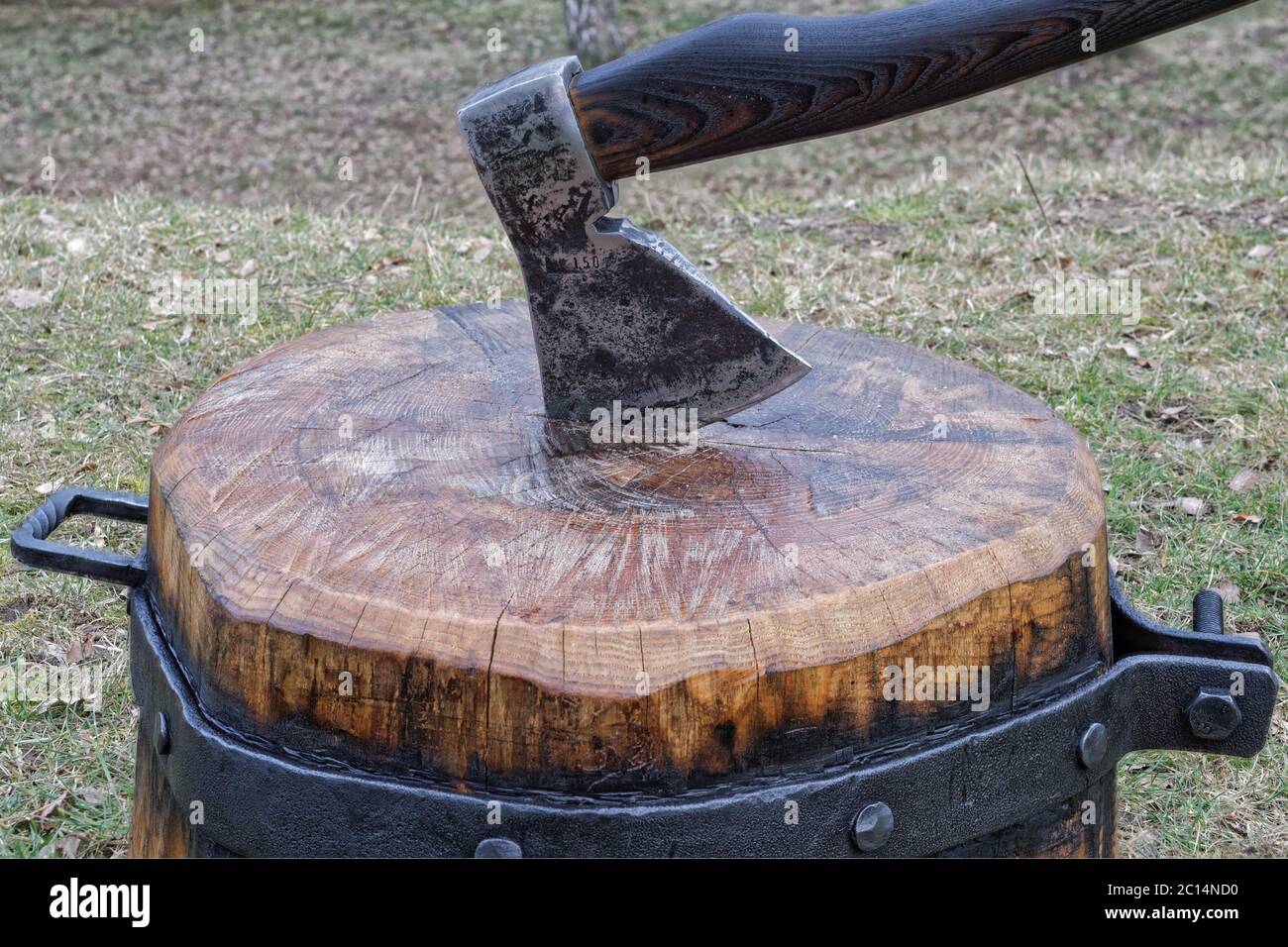 The axe stuck in the chopping block Stock Photo - Alamy