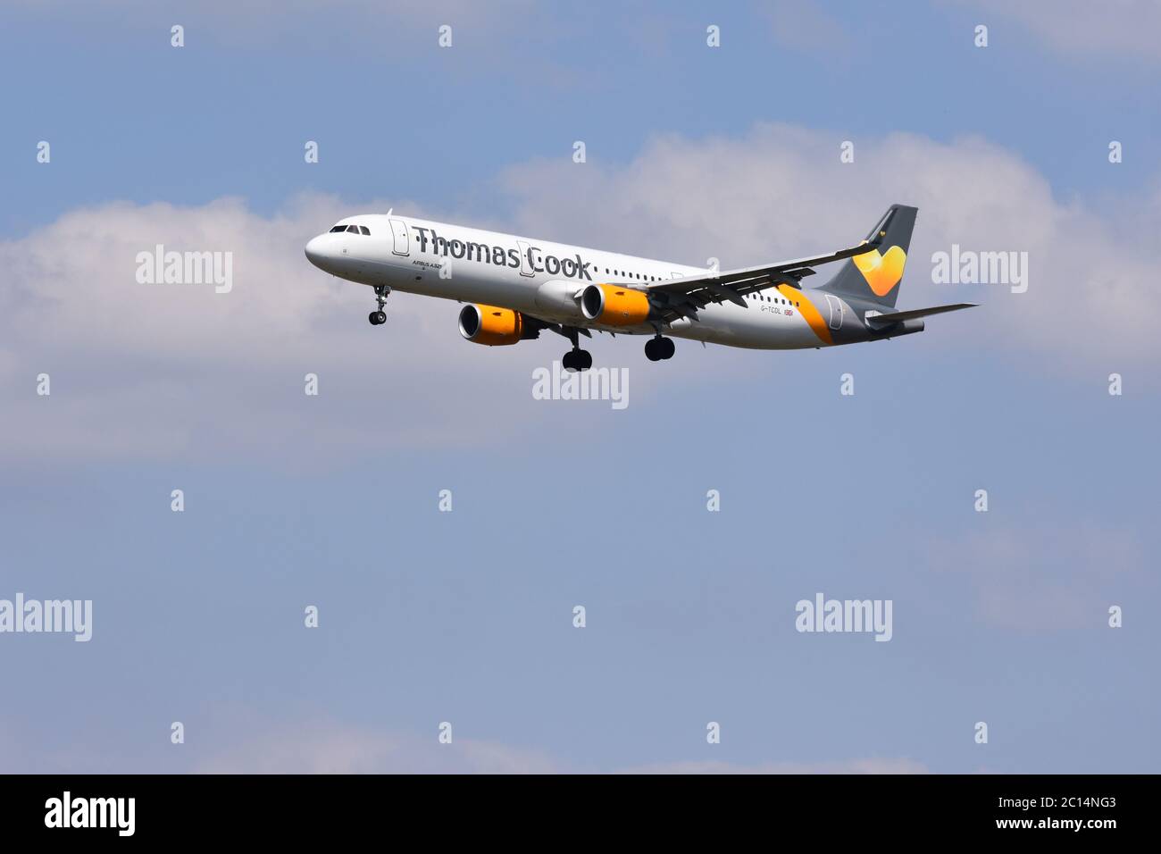 A Thomas Cook passenger plane in the sky just outside Bristol Airport ...