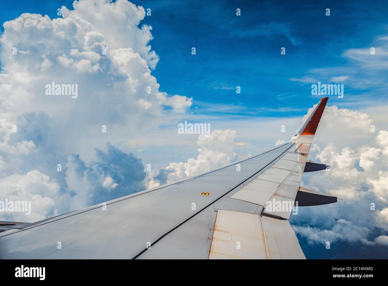Looking out through window of the airplane during beautiful sunrise or ...