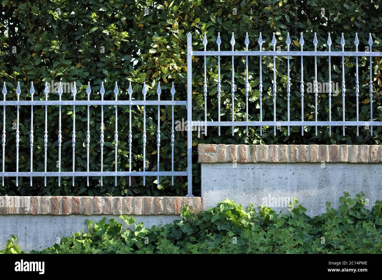 Metallic fence on a little brick wall (Pesaro, Italy, Europe Stock ...