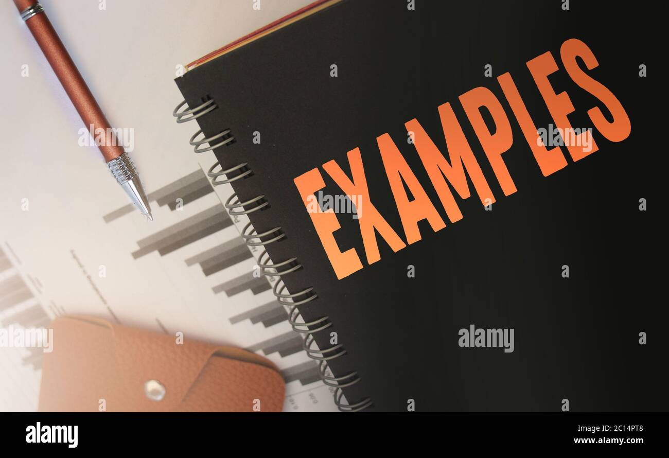 Examples word written on a copybook cover orange on black. Business and ...
