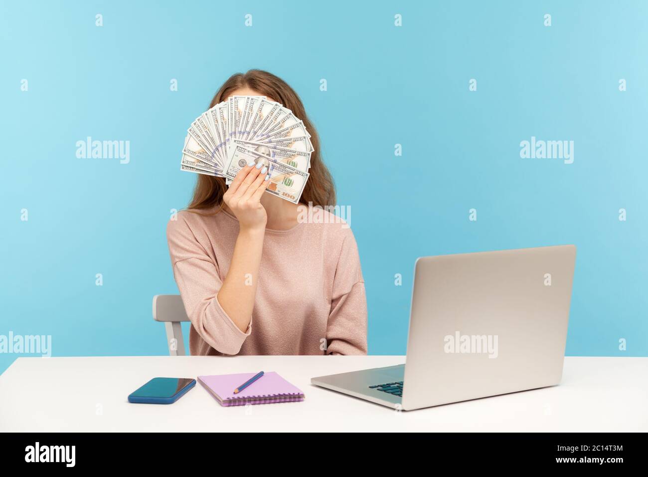 Money making advertisement. Woman employee sitting at workplace and ...