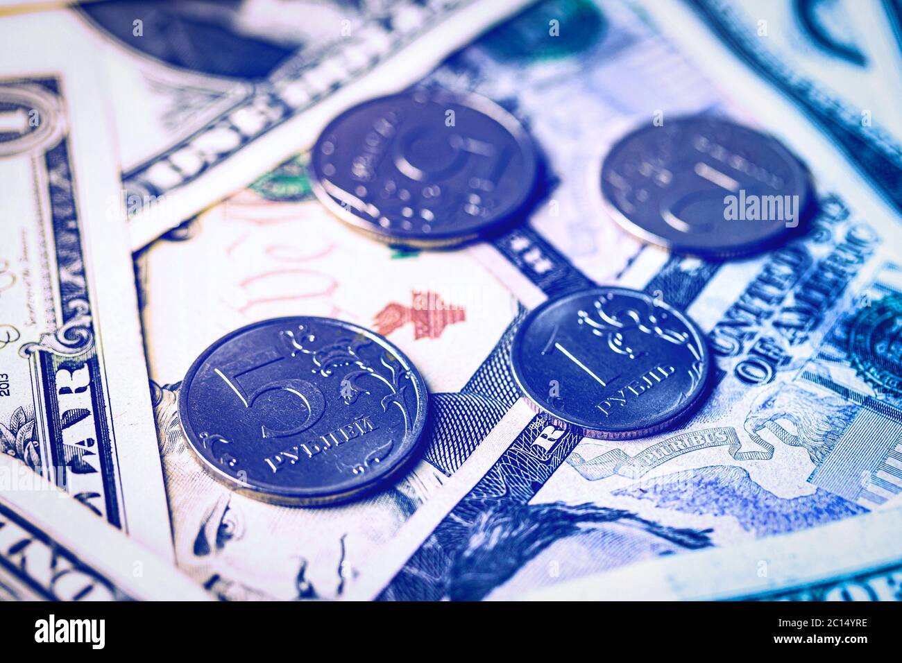 Ruble coins on the background of dollar bills. Exchange rate concept ...