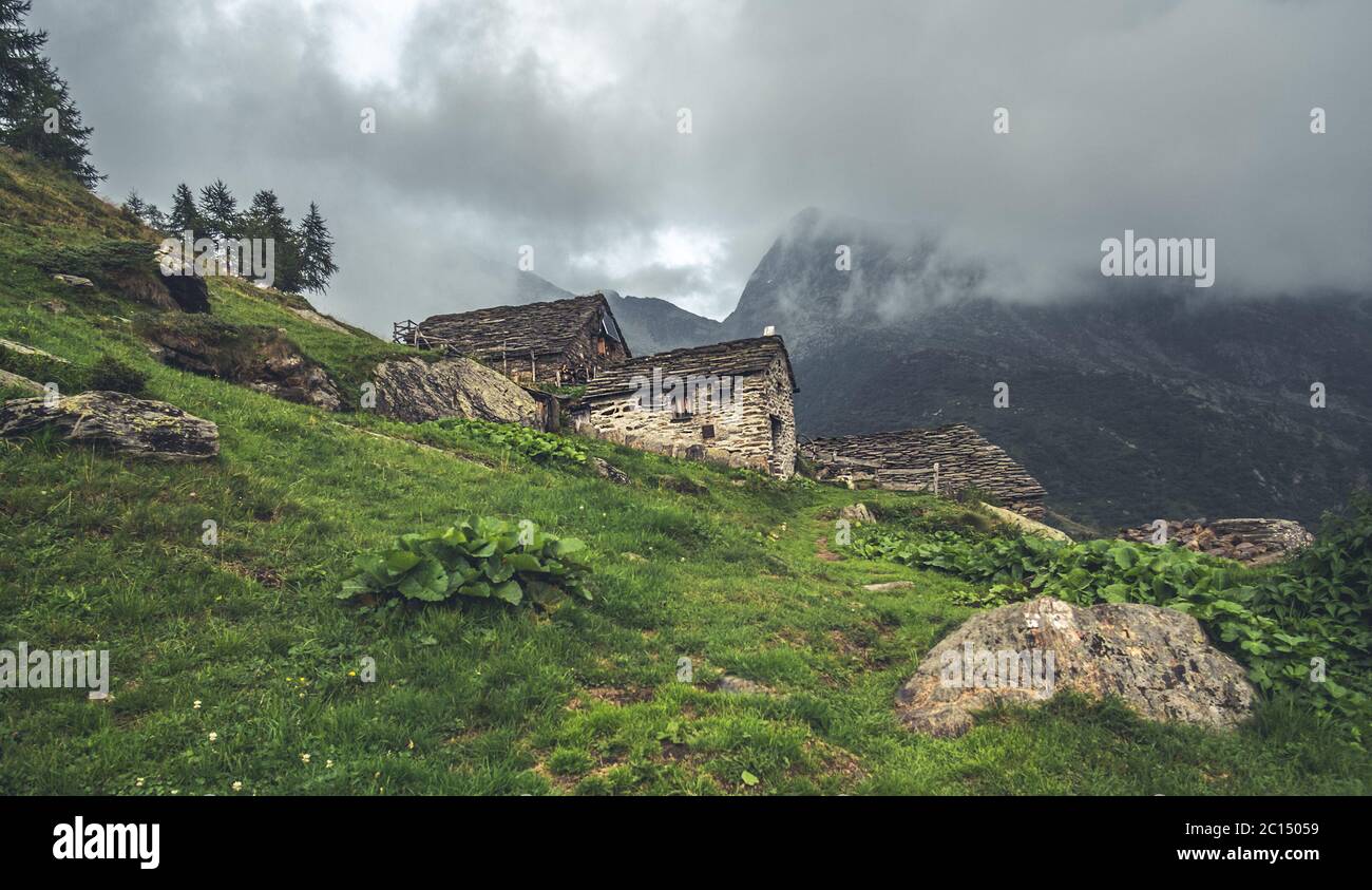 Abandoned building high in alpine mountains Stock Photo - Alamy