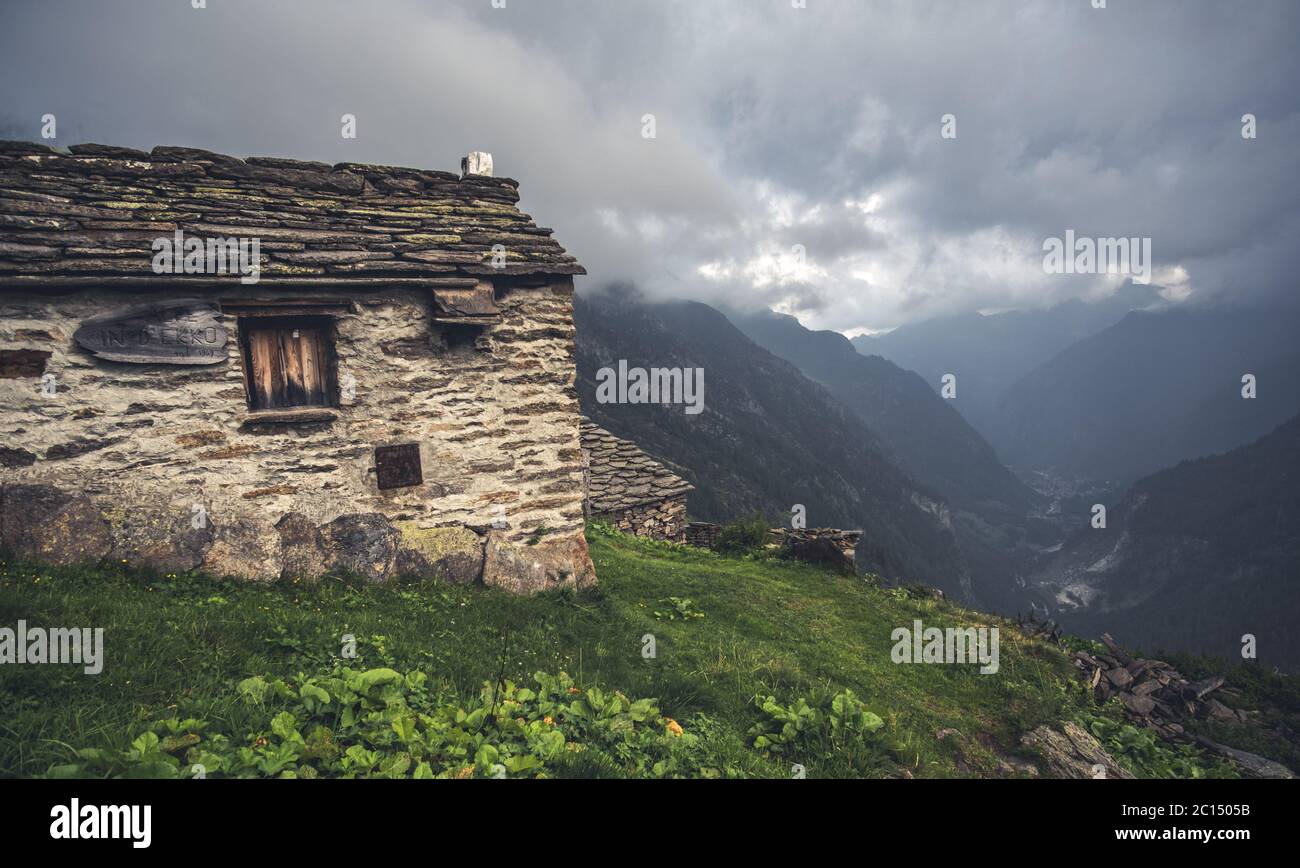 House looking down on panoramic alpine valley Stock Photo - Alamy