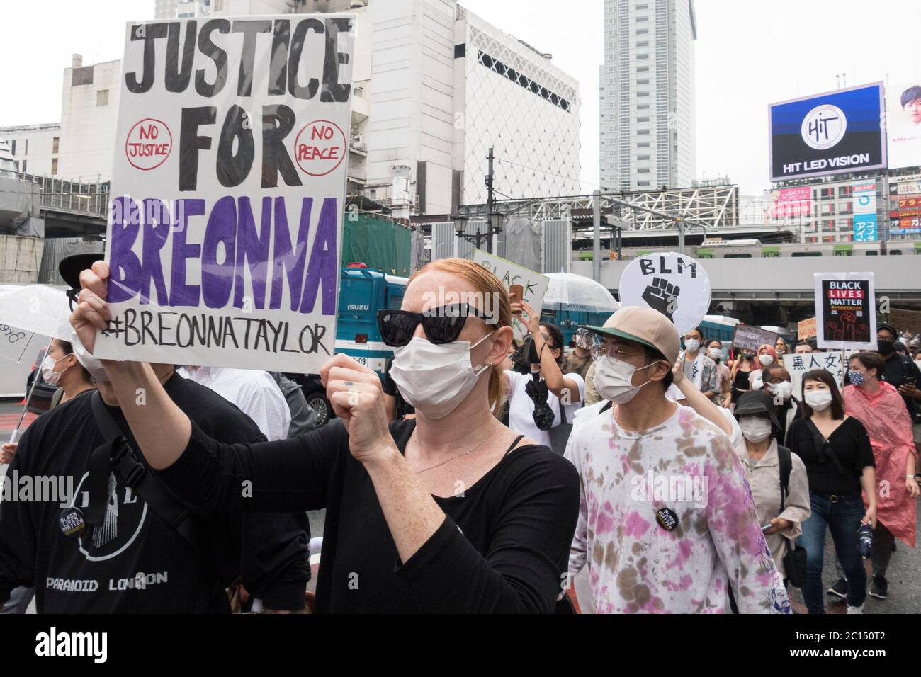 Tokyo, Japan. 14th June, 2020. Demonstrators wearing face masks protest ...