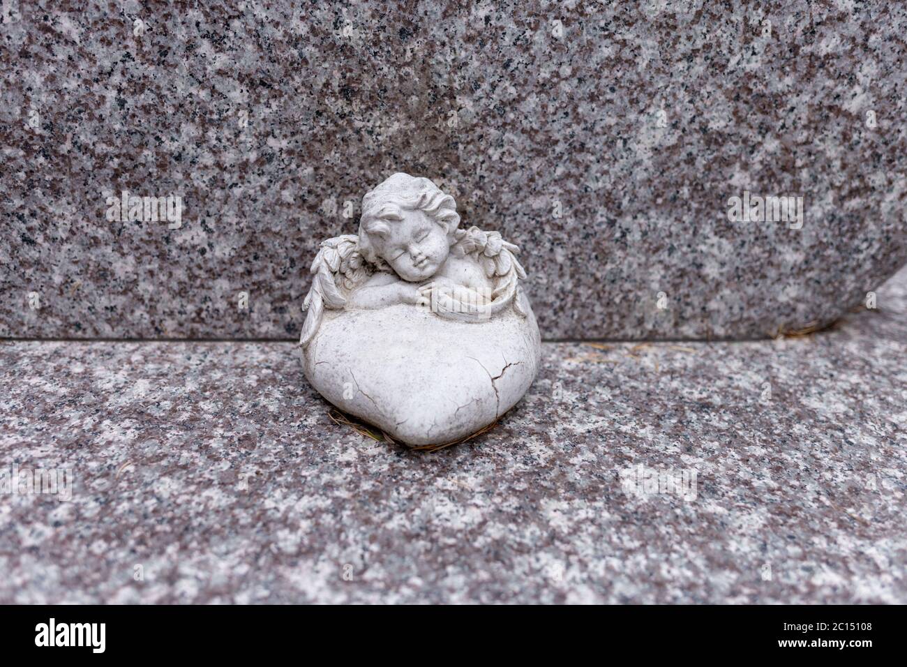 stoned angel on heart shape stone at cemetery, grave sculpture, RIP ...