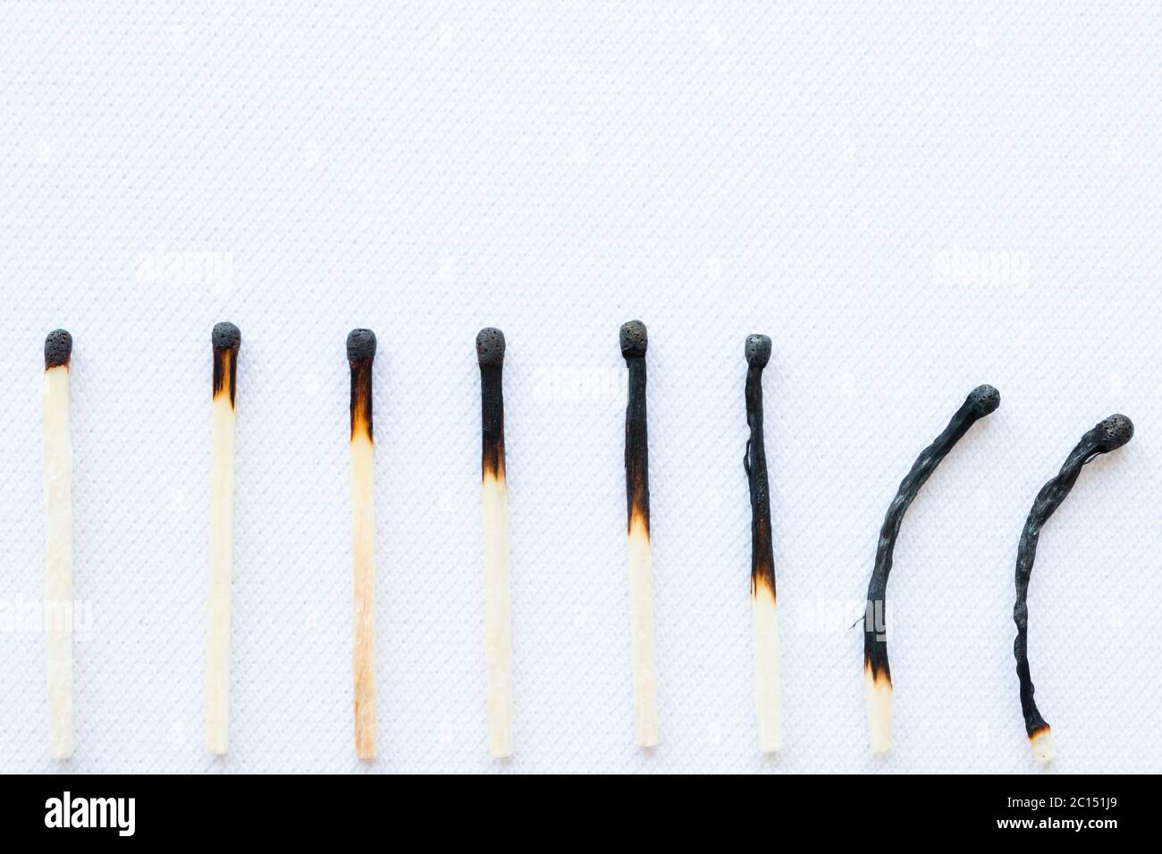 stage of burning matches on a white background Stock Photo - Alamy