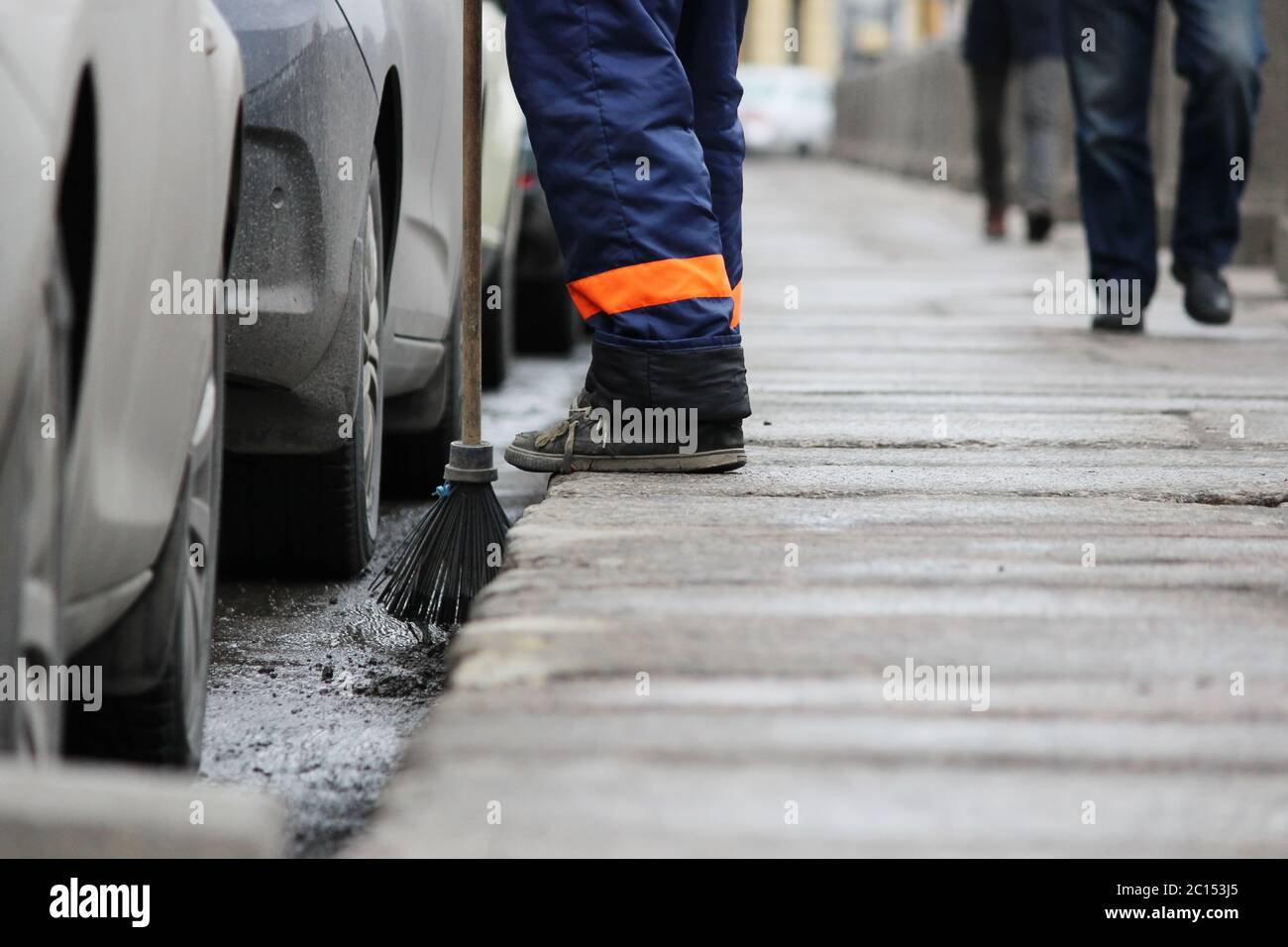 Cleaner sweeping uniform urban hi-res stock photography and images - Alamy