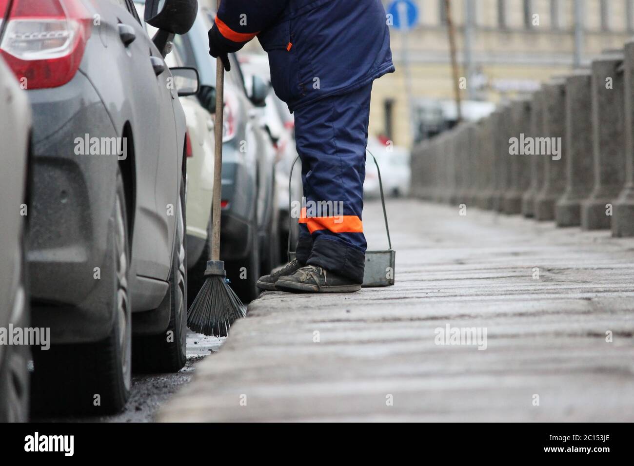Man sweeping street hi-res stock photography and images - Alamy