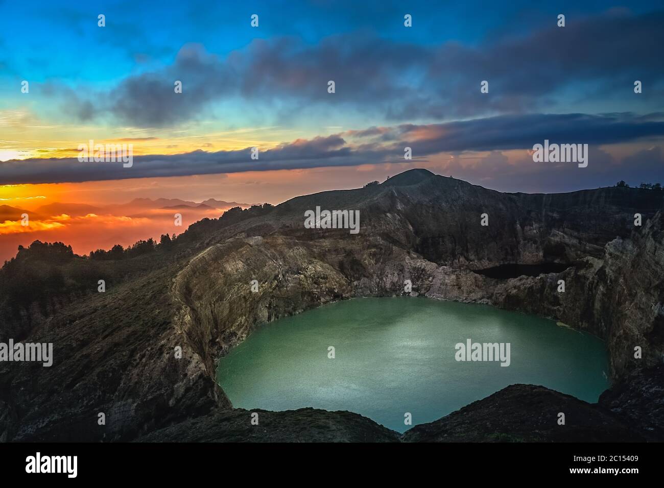 Crater of the kelimutu volcano at sunrise hi-res stock photography and ...
