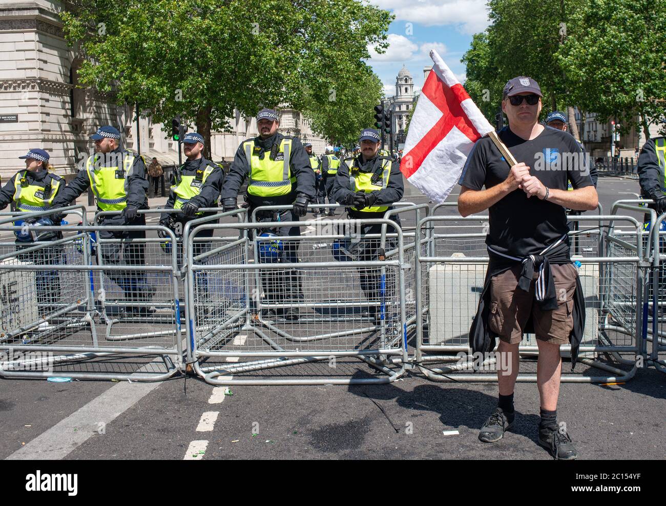 Riot police in Whitehall behind barriers, preventing Britain First far ...