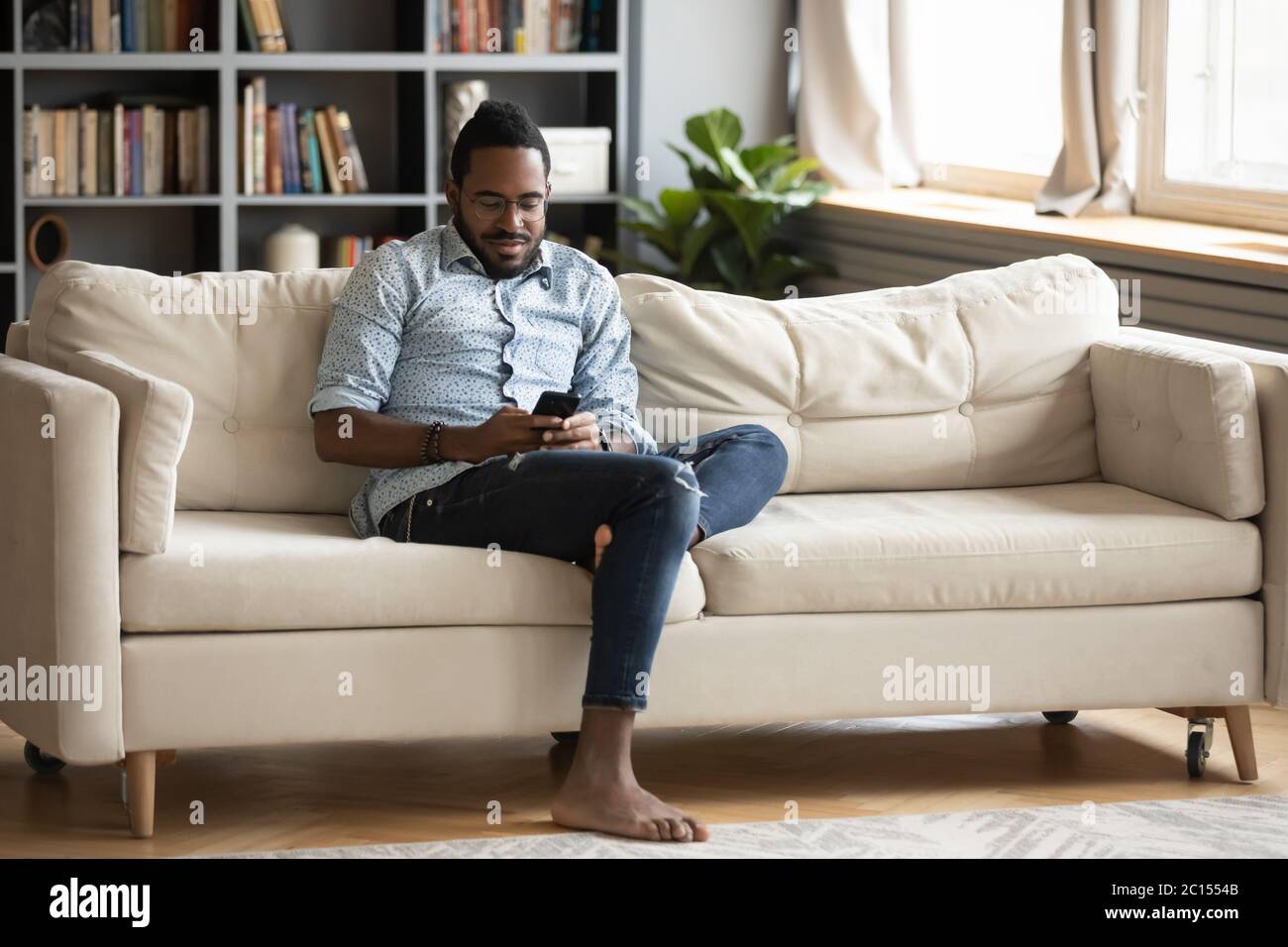 African american man sitting resting hi-res stock photography and ...