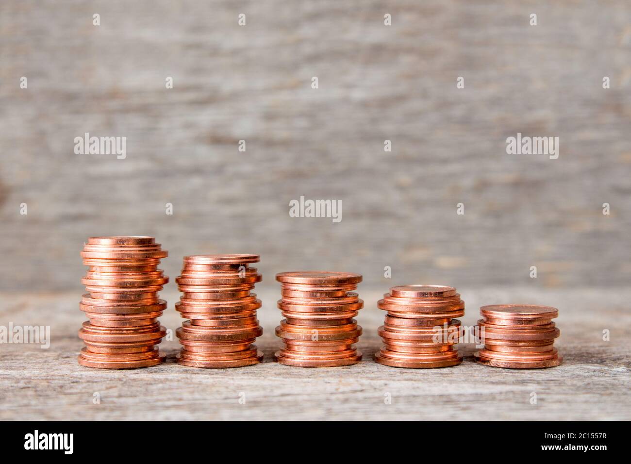 Five stacks of copper coins Stock Photo - Alamy