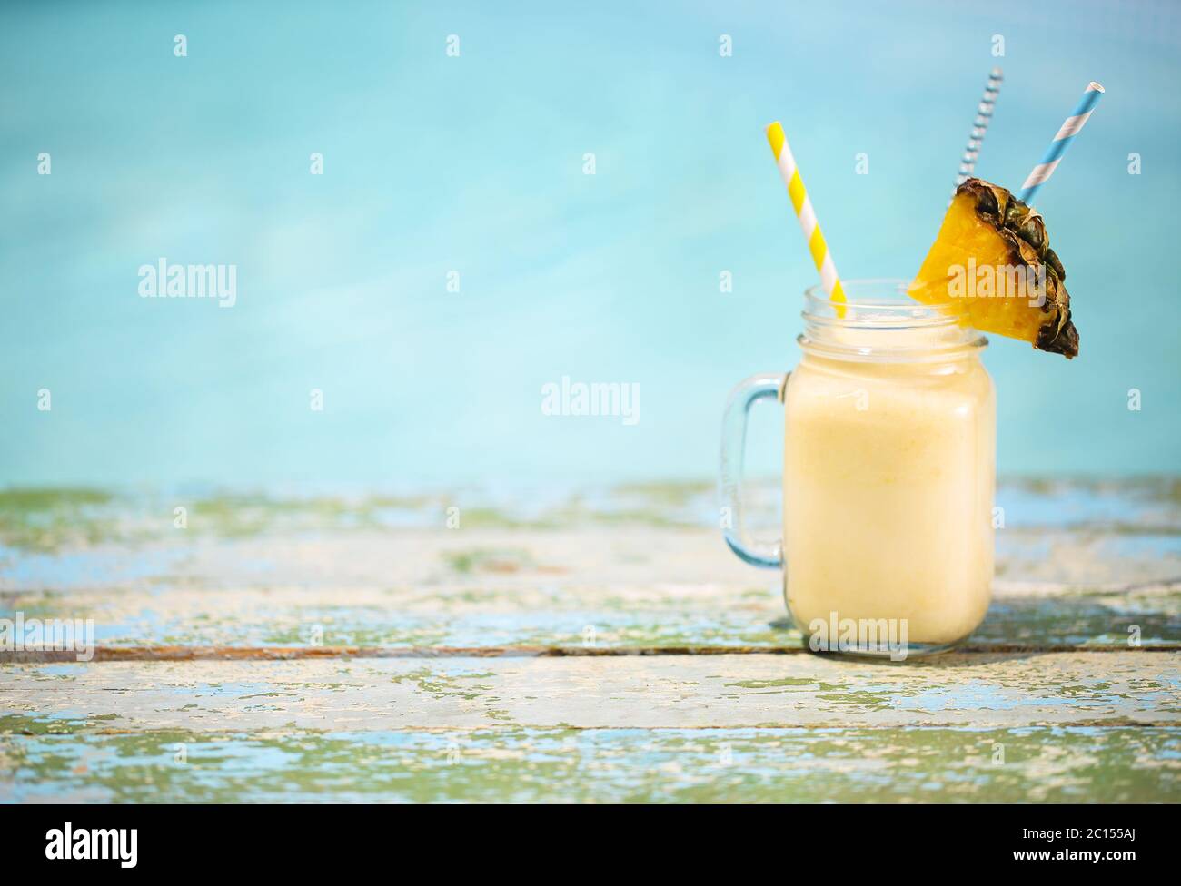 Exotic pineapple cocktail near pool. Pina colada Stock Photo - Alamy