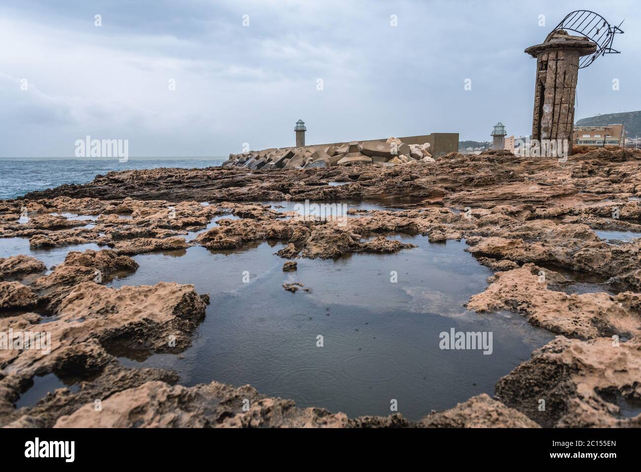 Old lighthouse in port of Batroun city in northern Lebanon and one of ...