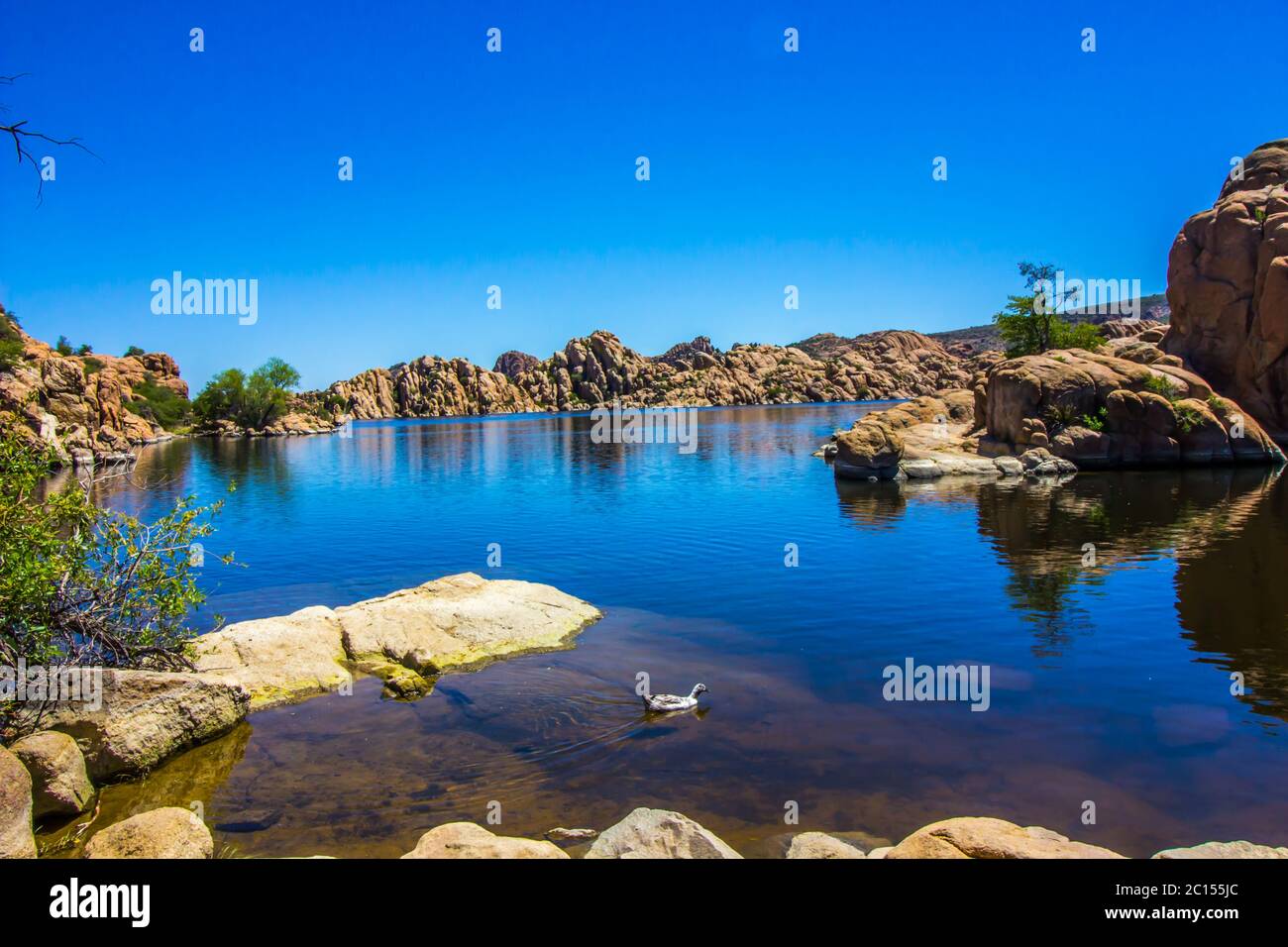 Shallow Shoreline Of Mountain Lake With Unique Rock Formations Stock ...