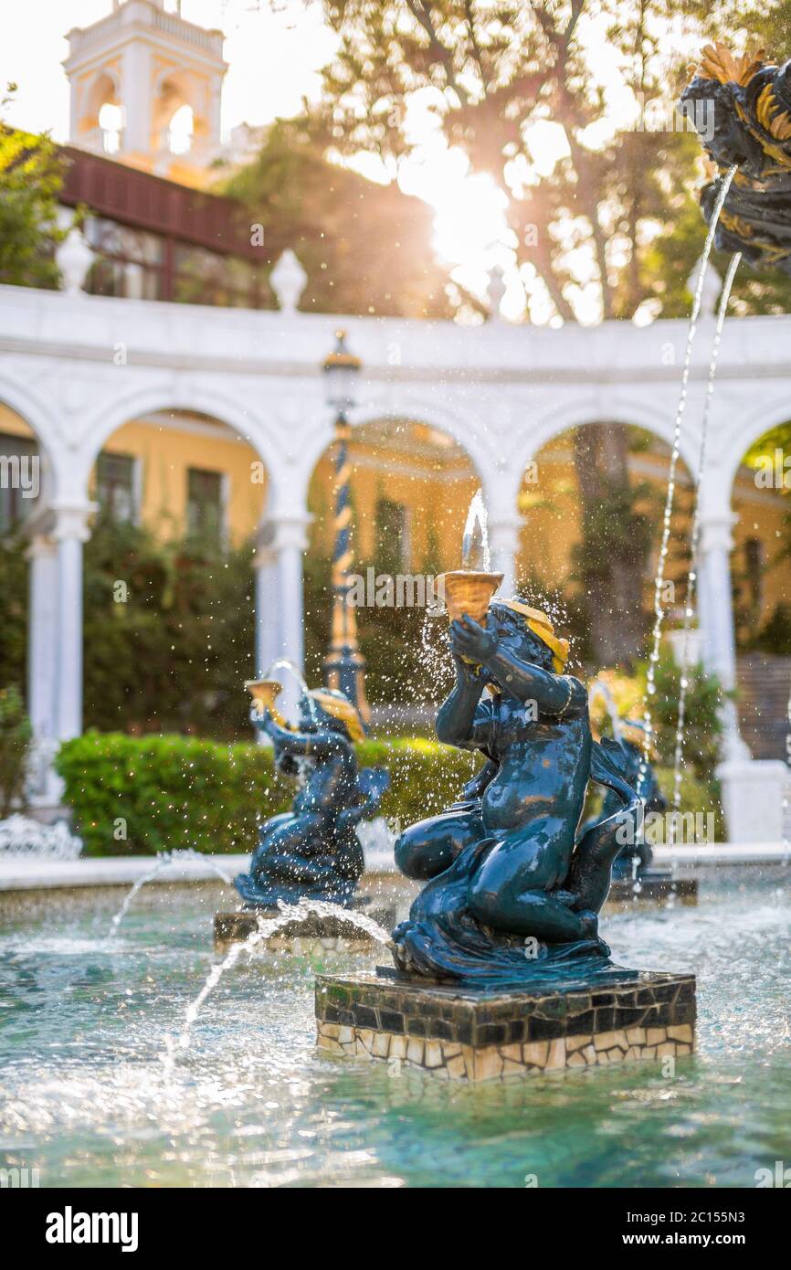Angel playing trumpet in splashes of a fountain. Elements of a fountain ...