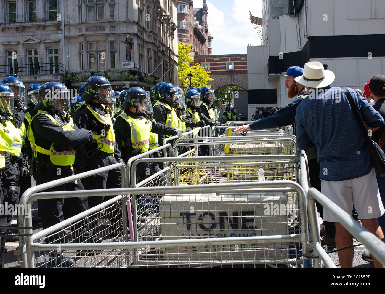 Riot police in Whitehall behind barriers, preventing Britain First far ...